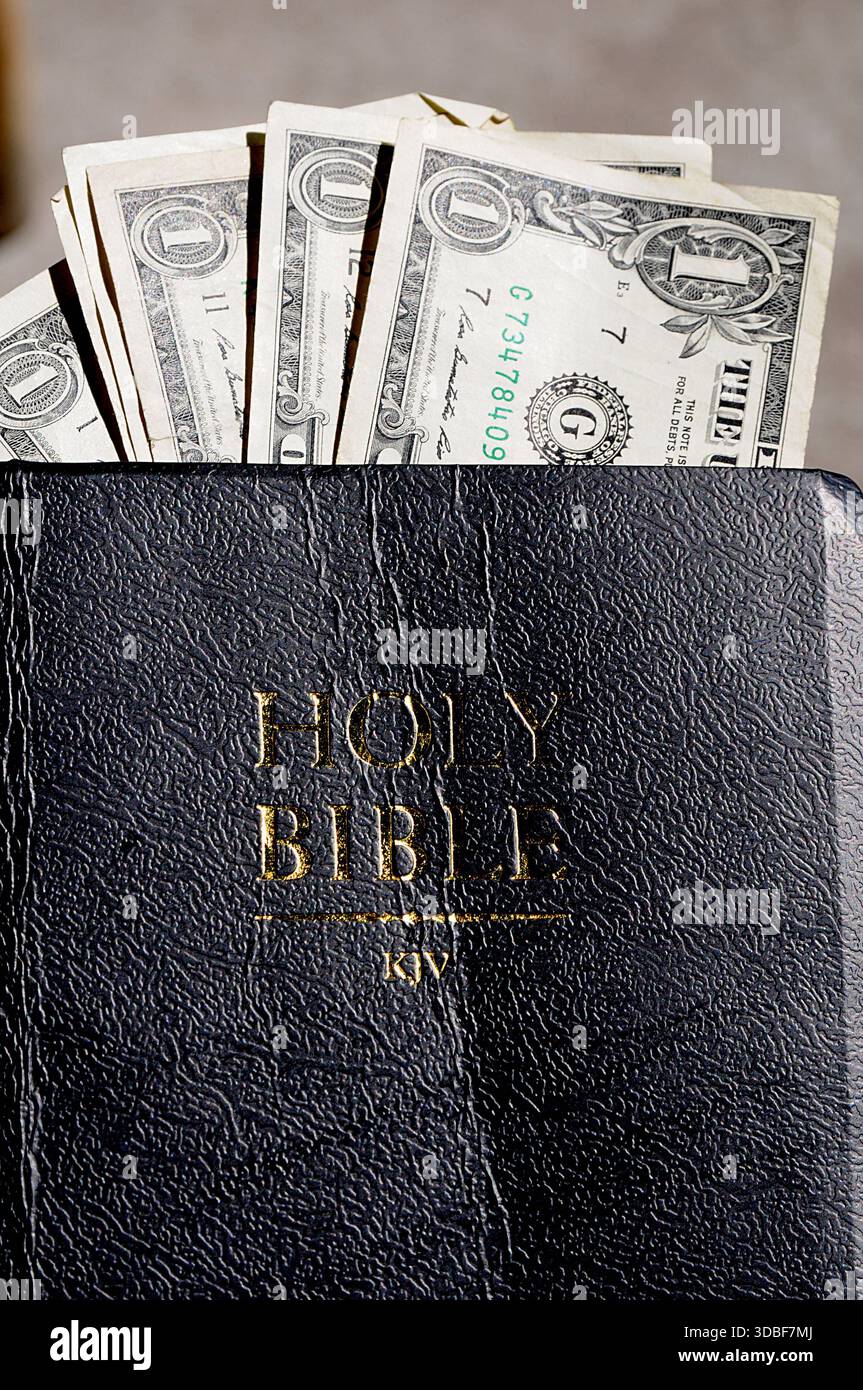 Copenhagen/Denmark 15.JULY 2018 Holy bible and money in chistaisn faith ...