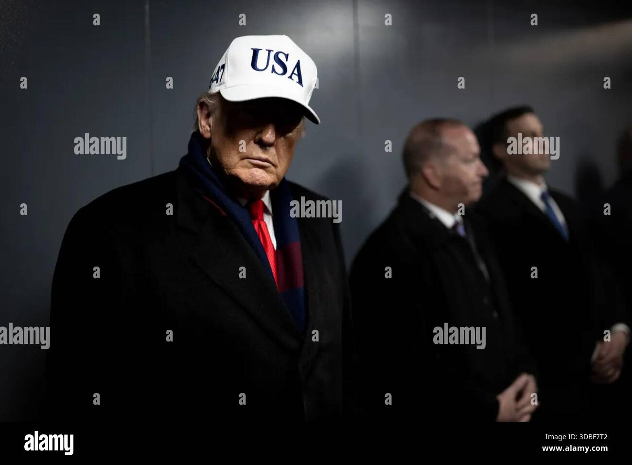 President Donald Trump stands backstage wearing a USA cap during the ...