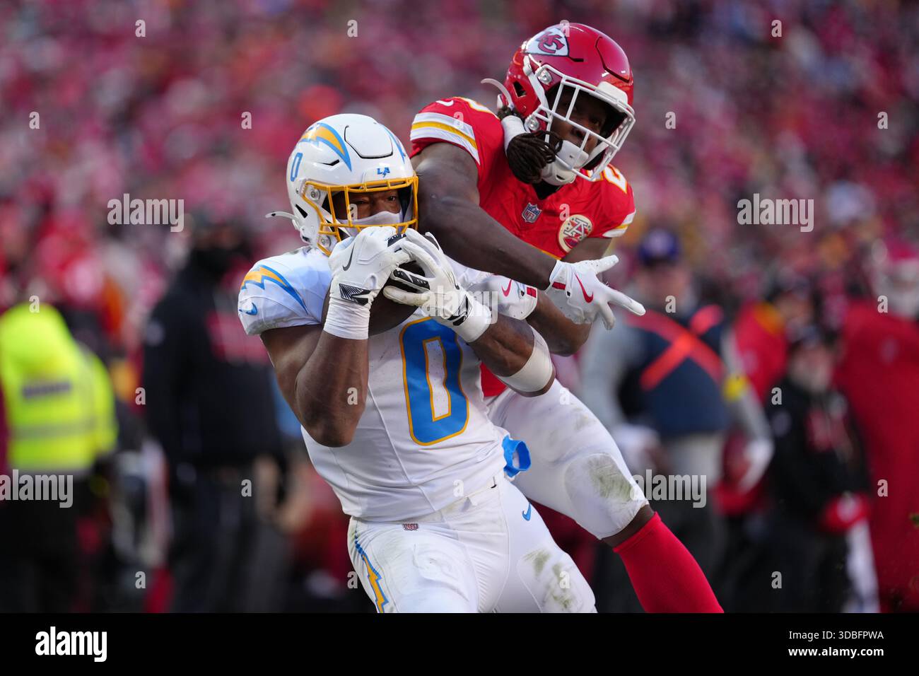 Los Angeles Chargers' Dailyan Henley intercepts a pass intended for ...