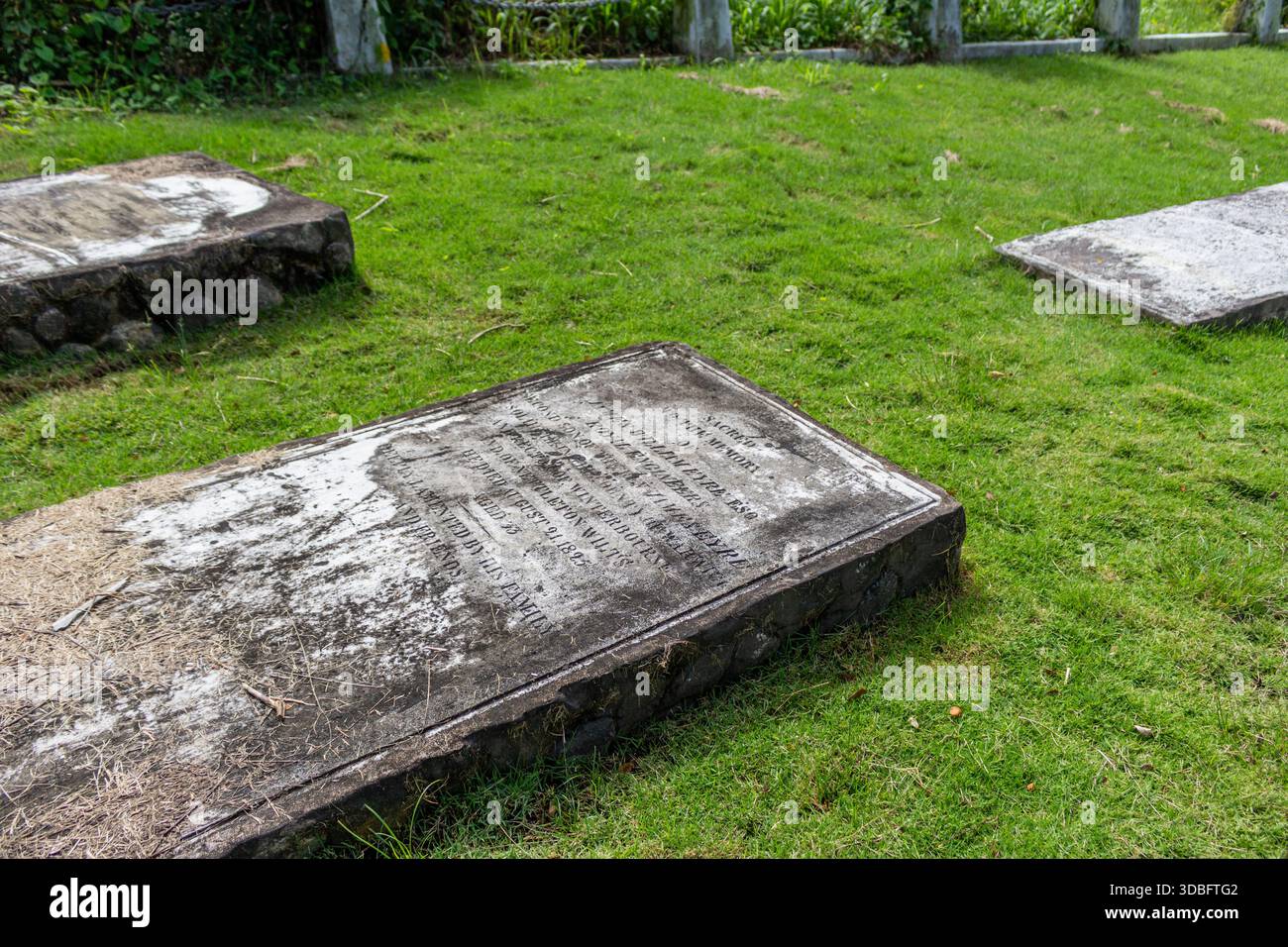 Graves of fallen soldiers at Fort King George in Tobago, historic stone ...