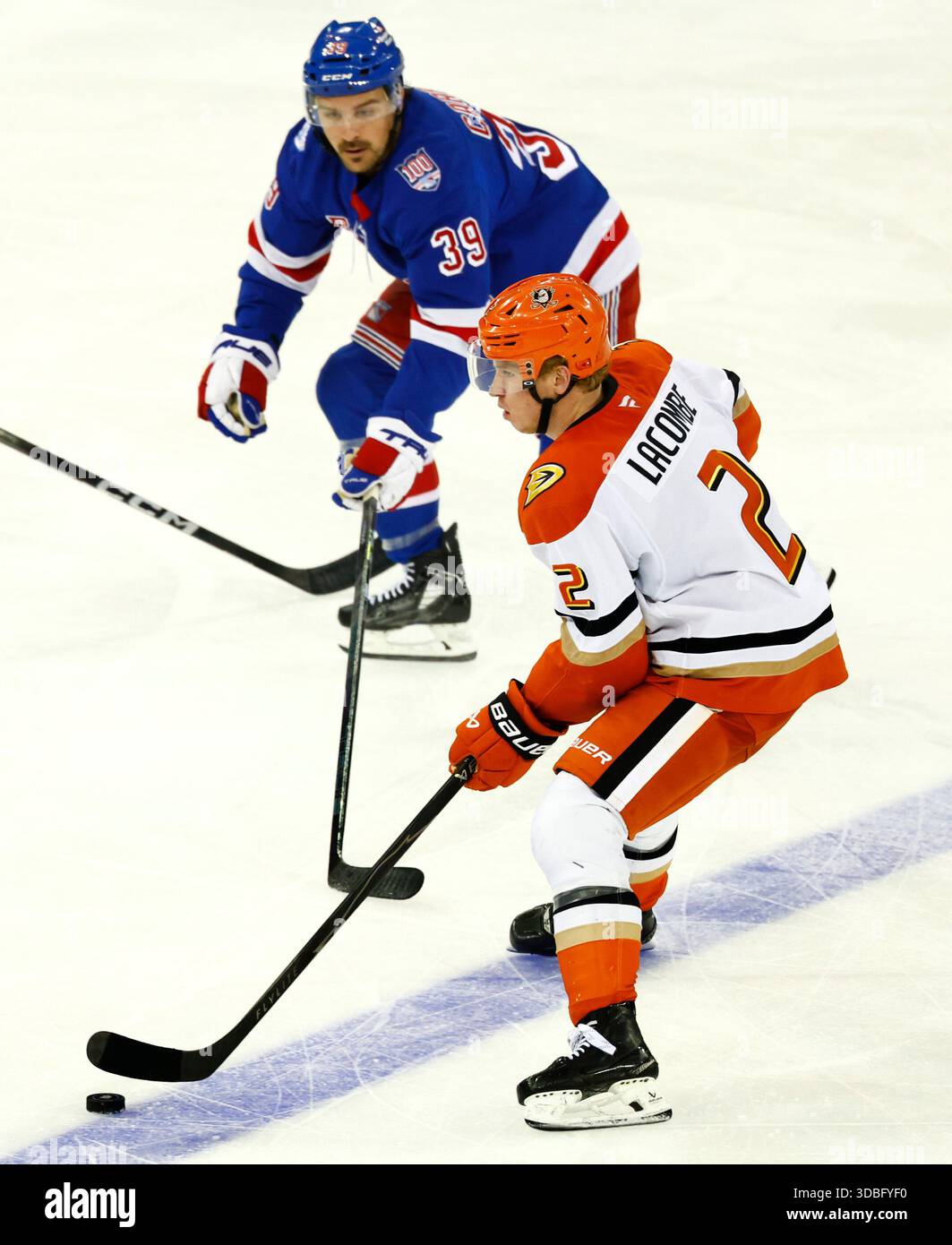 Anaheim Ducks defenseman Jackson Lacombe (2) skates with the puck ...