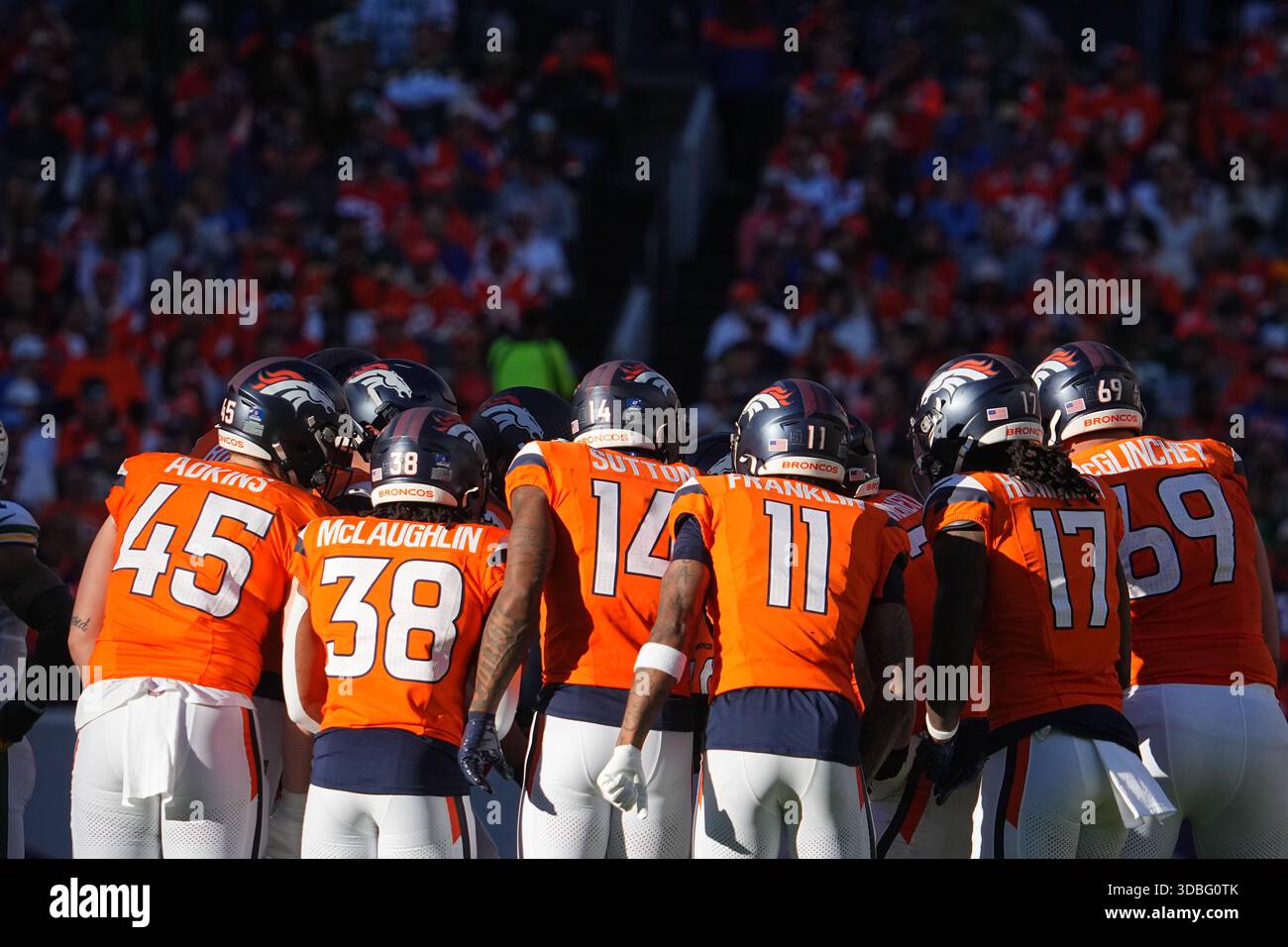 The Denver Broncos offense huddles up against the Green Bay Packers ...