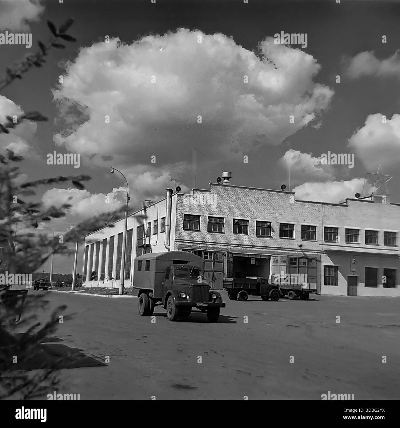 Black and white archival photo capturing the exterior of a large Soviet ...