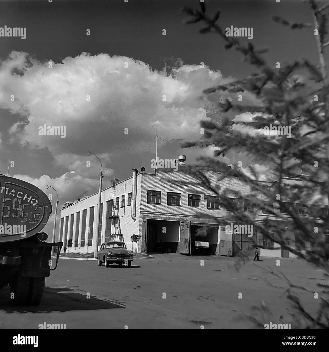 Black and white archival photo capturing the exterior of a large Soviet ...