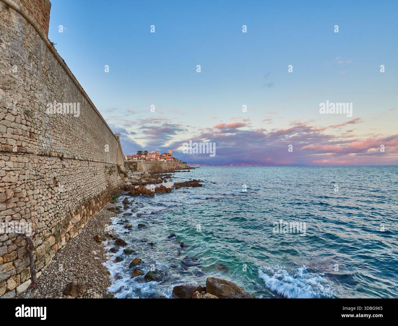 Historic Stone Sea Wall Along Turquoise Water at Sunset in The Coastal ...