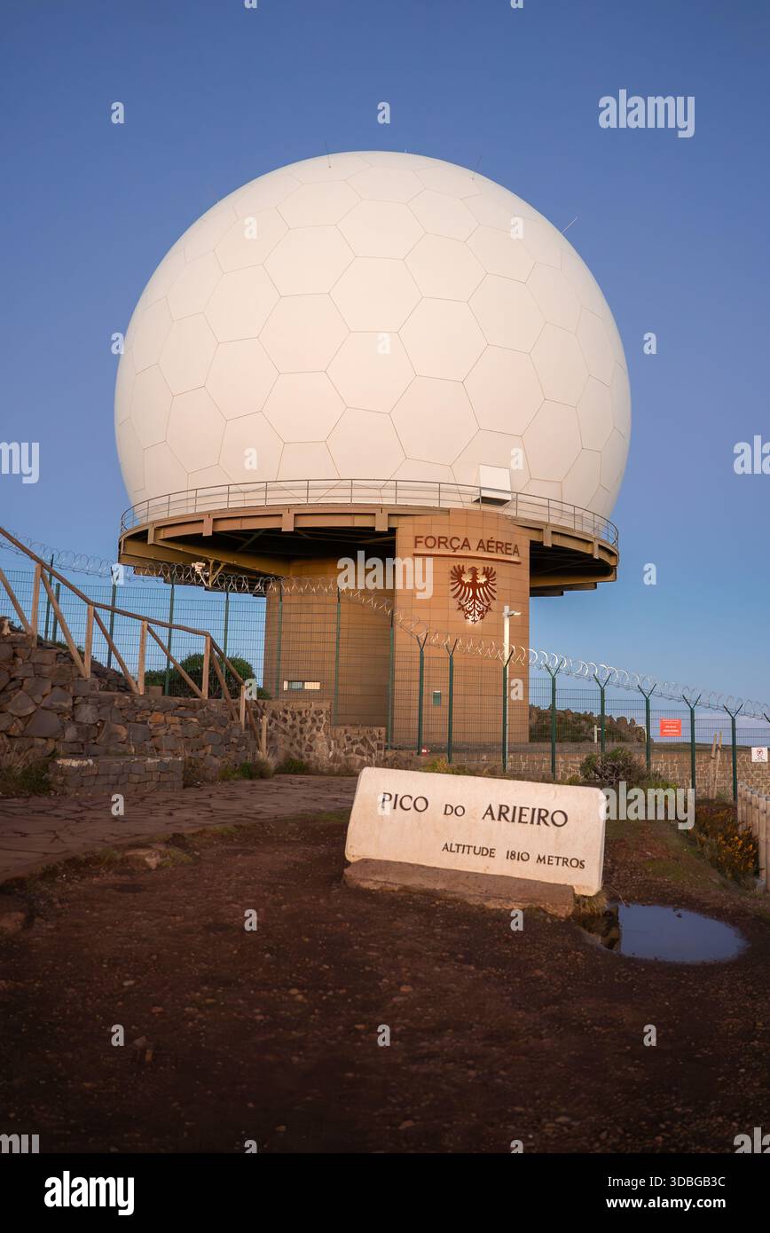 A white geodesic radar dome rises over a Forca Aerea base with eagle ...