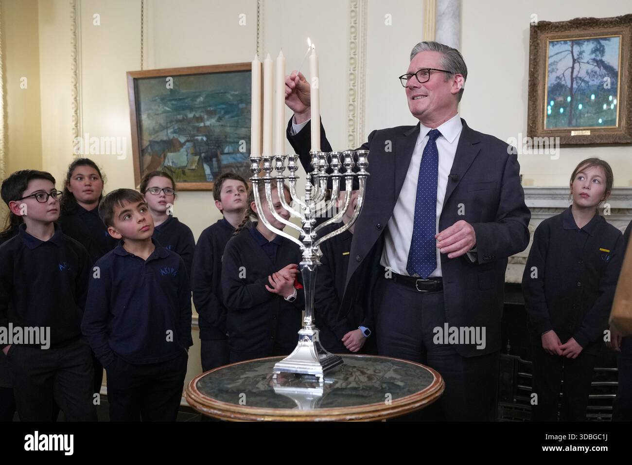 Prime Minister Sir Keir Starmer lights a candle during a reception at ...