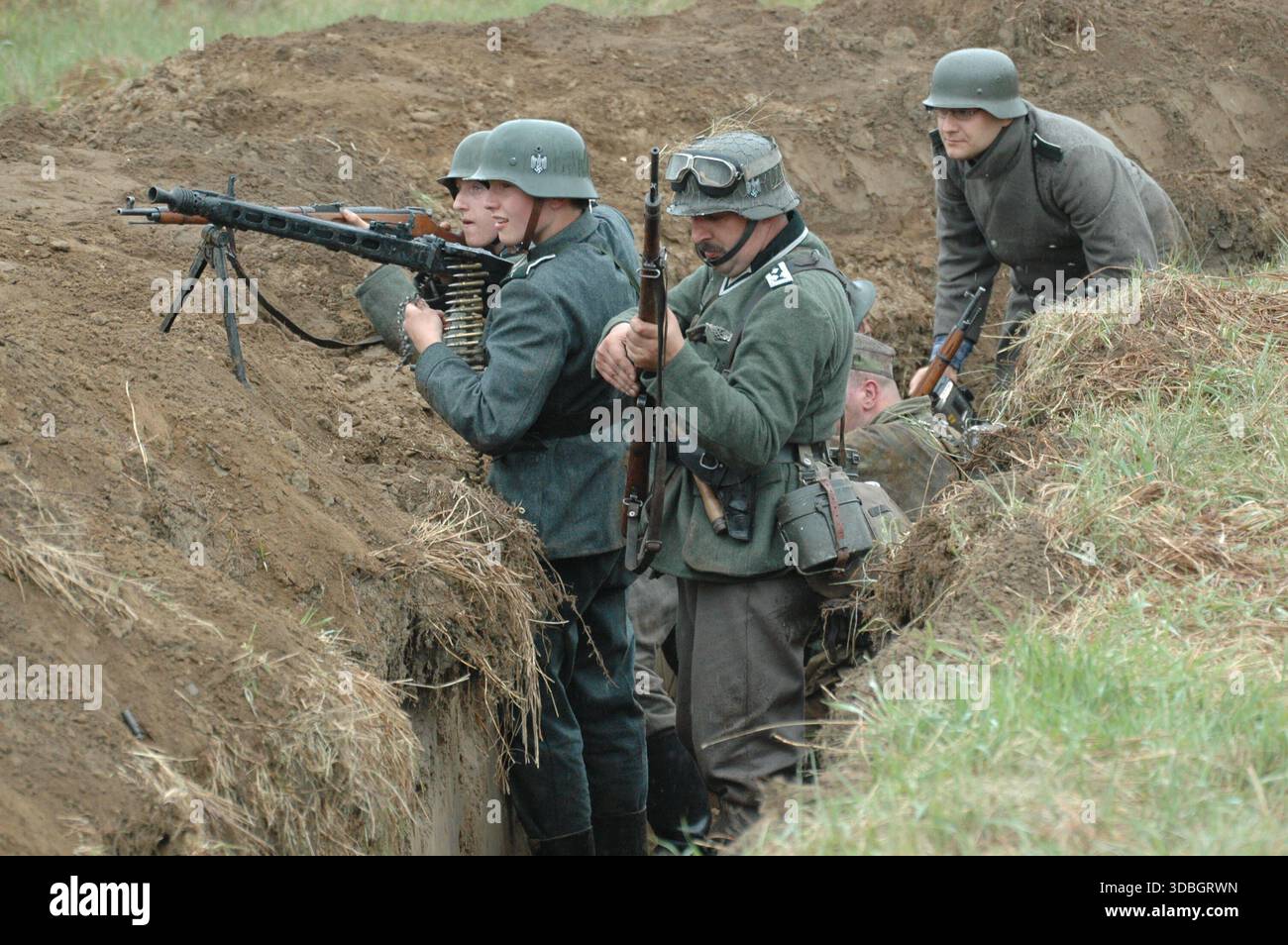 German Wehrmacht machine gun team inside captured trench during World ...