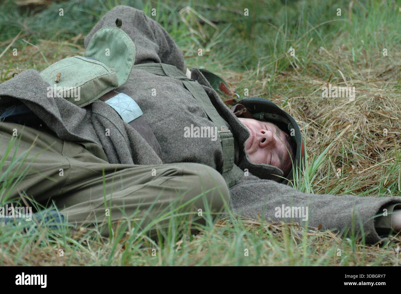Dead German Wehrmacht soldier lying on battlefield during World War II ...