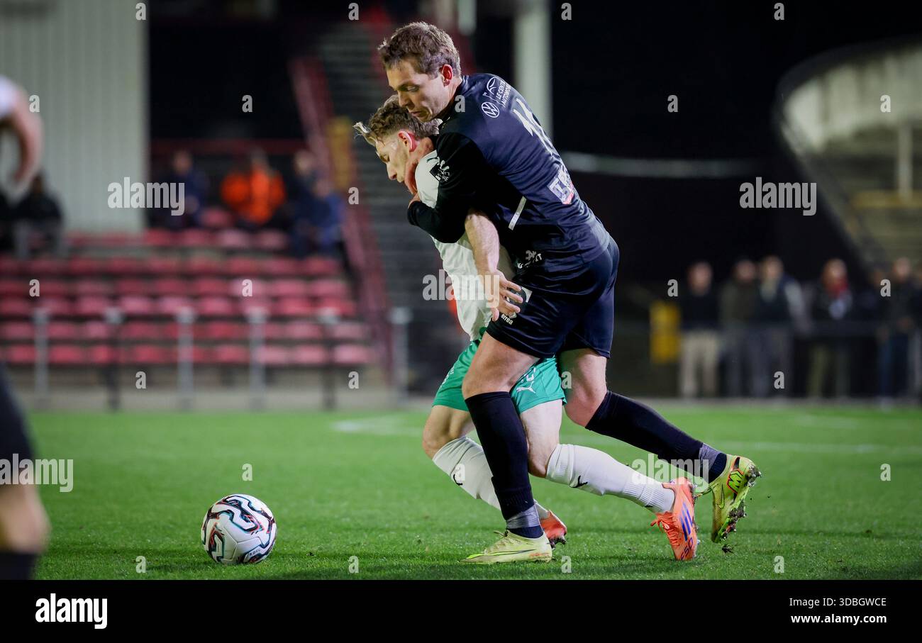 Lommel's Tom Reyners and Olympic's Luca Florica fight for the ball ...