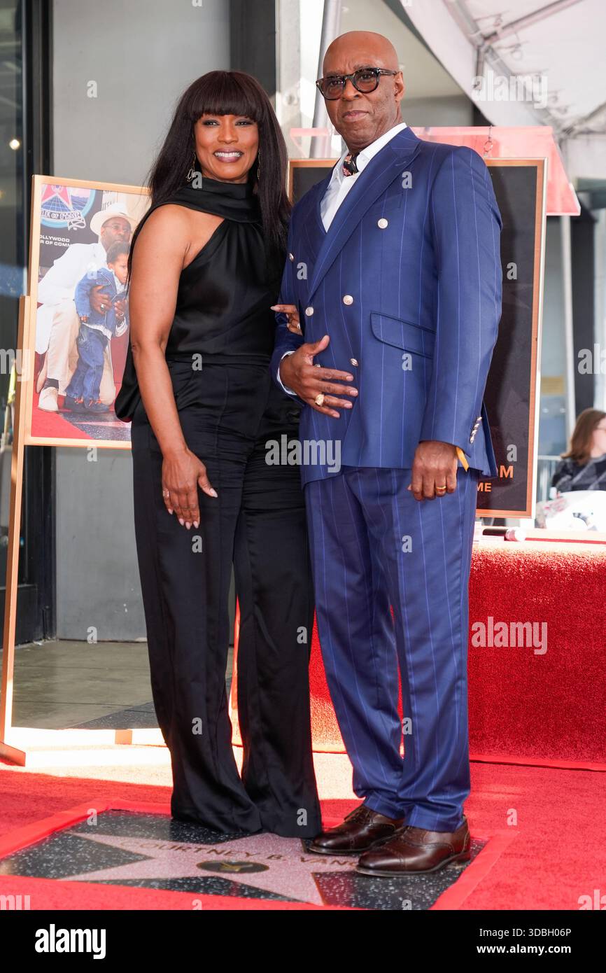Angela Bassett, left, and Courtney B. Vance pose with Vance's new star ...