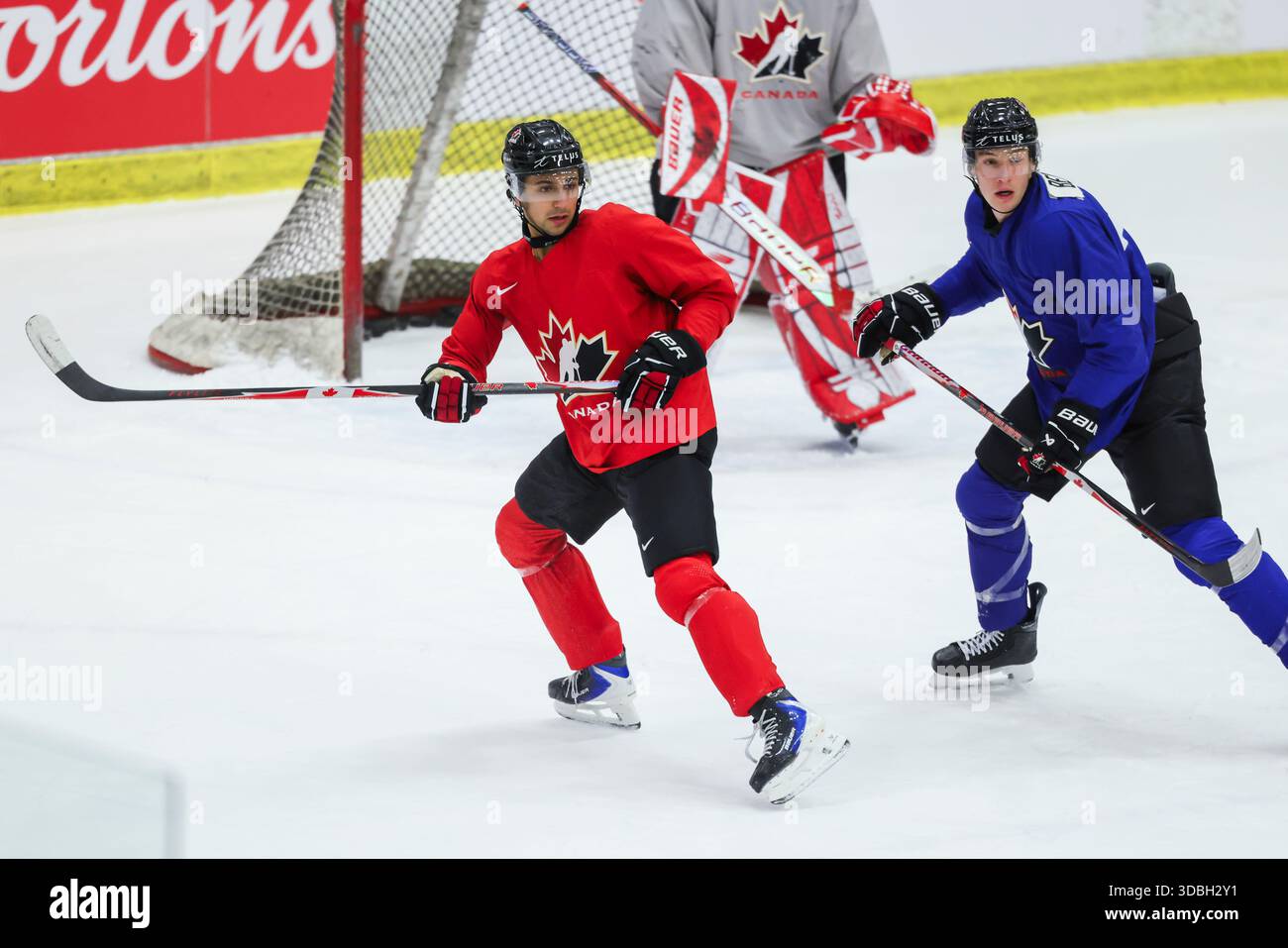 Michael Hage, left, of Mississauga, Ontario, fights for position in ...