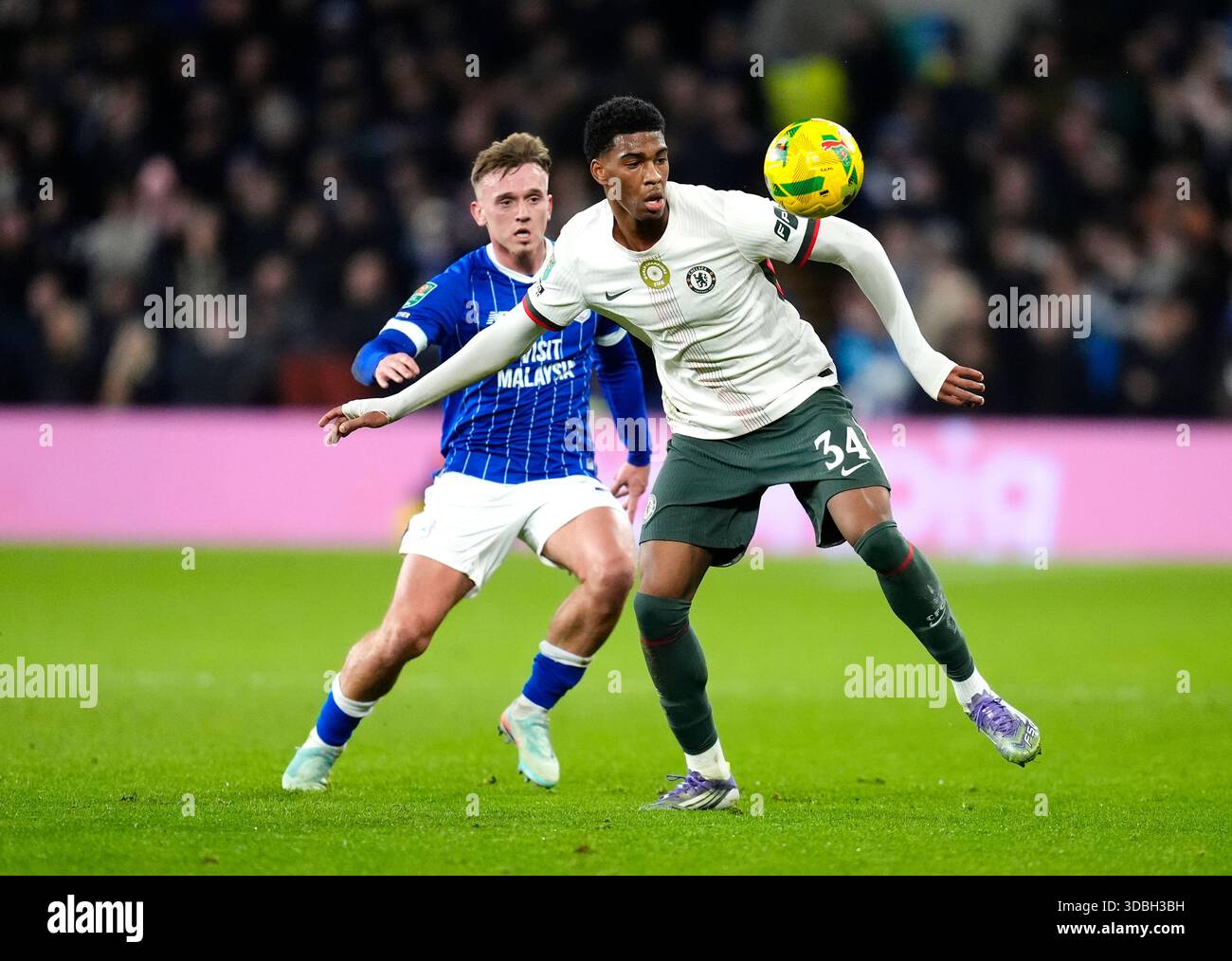 Chelsea's Josh Acheampong (right) and Cardiff City's Isaak Davies ...