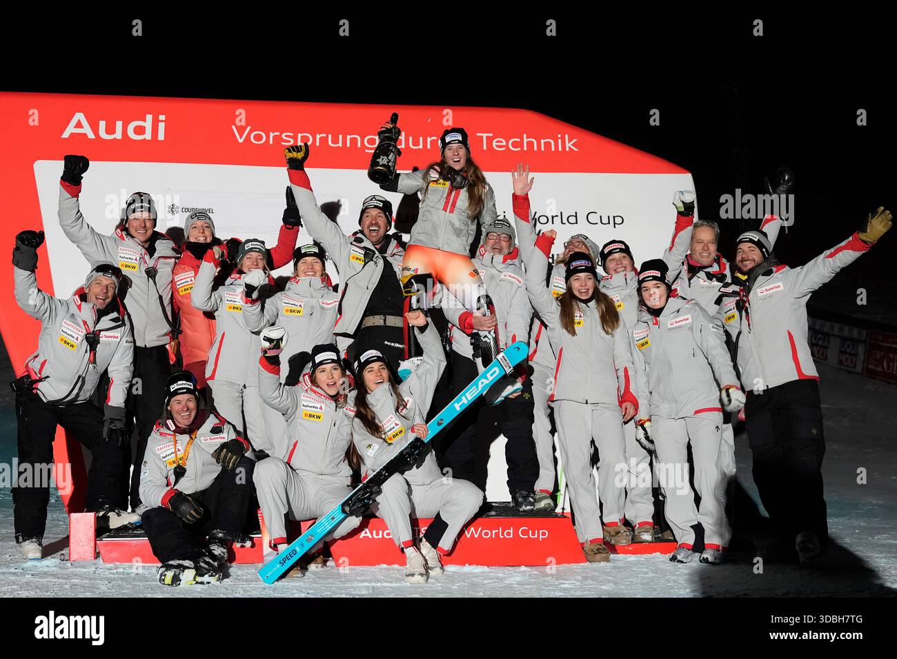 Switzerland's Camille Rast, center top, celebrates with the team after ...
