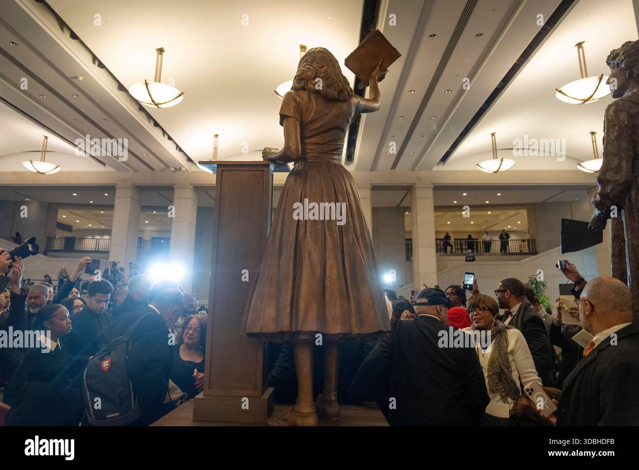 People take photos of a statue of Virginia civil rights activist ...