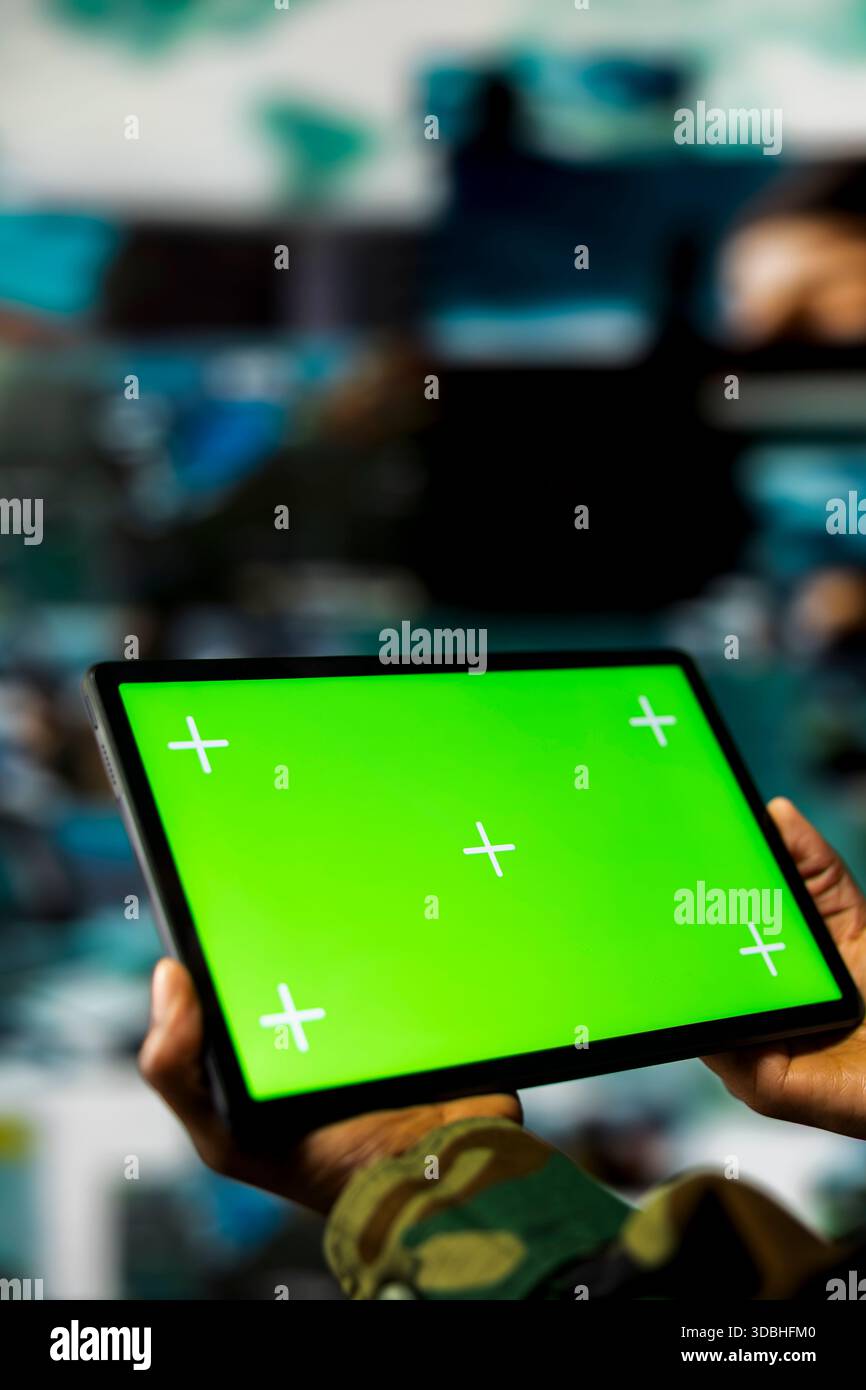 Close up of army unit in command center using isolated screen tablet ...