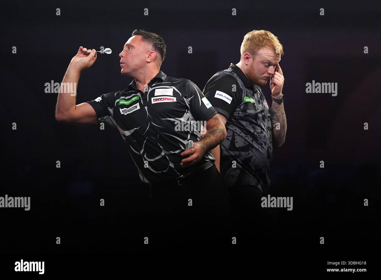 Gerwyn Price (left) in action against Adam Gawlas on day six of the ...