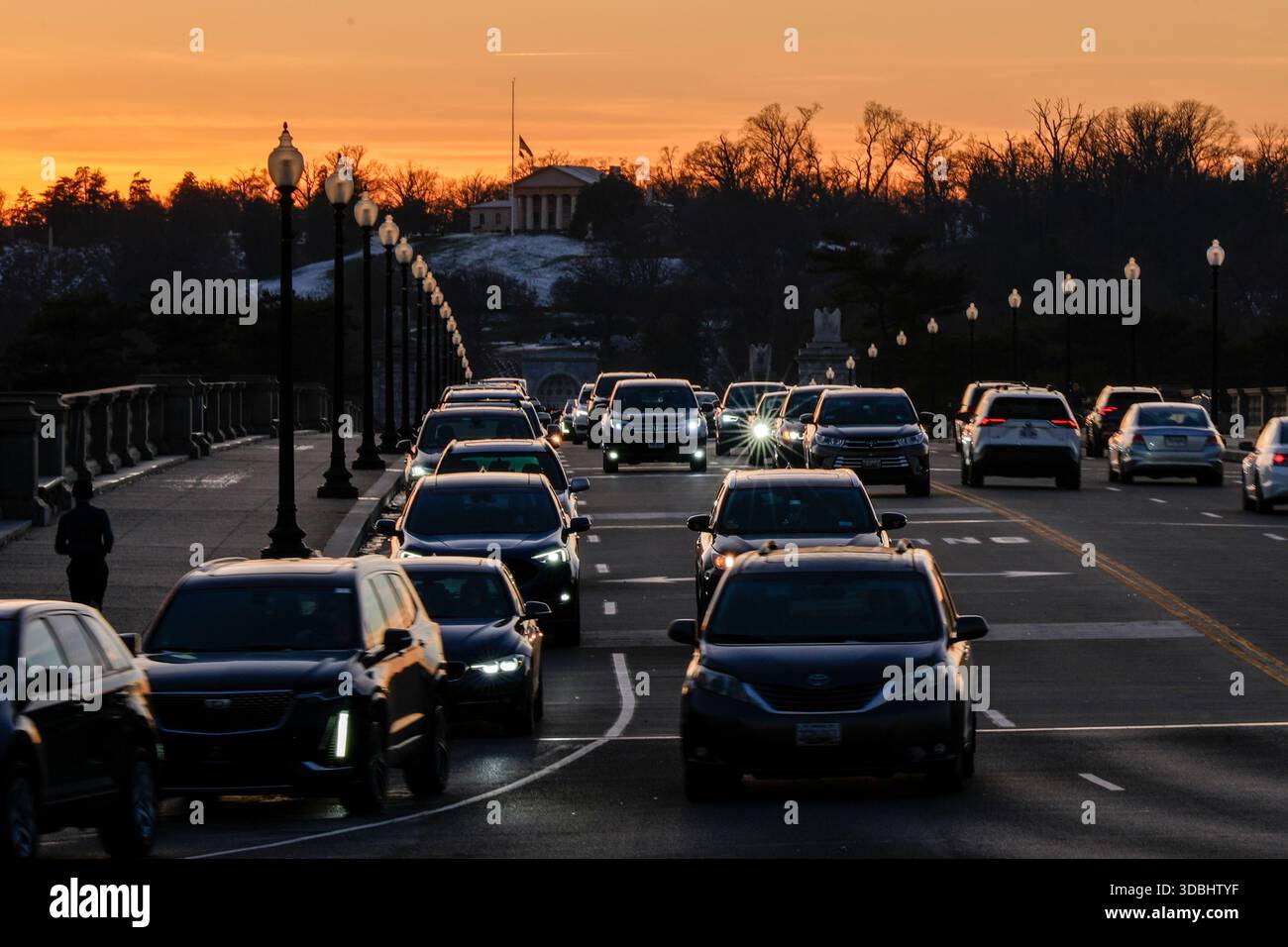 Cars drive over the Arlington Memorial Bridge, near where President ...