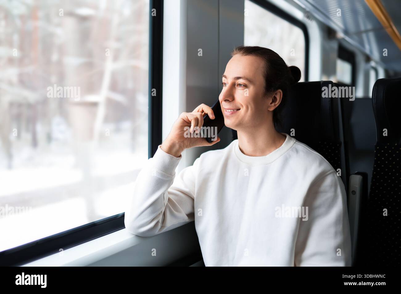 Guy sitting high on snow hi-res stock photography and images - Alamy