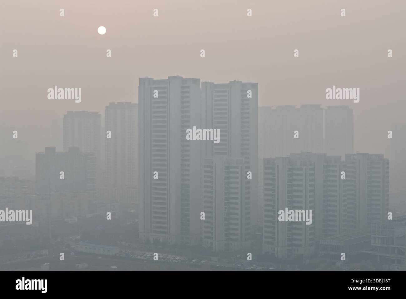 Buildings are faintly visible in the haze in Fuyang City, Anhui ...