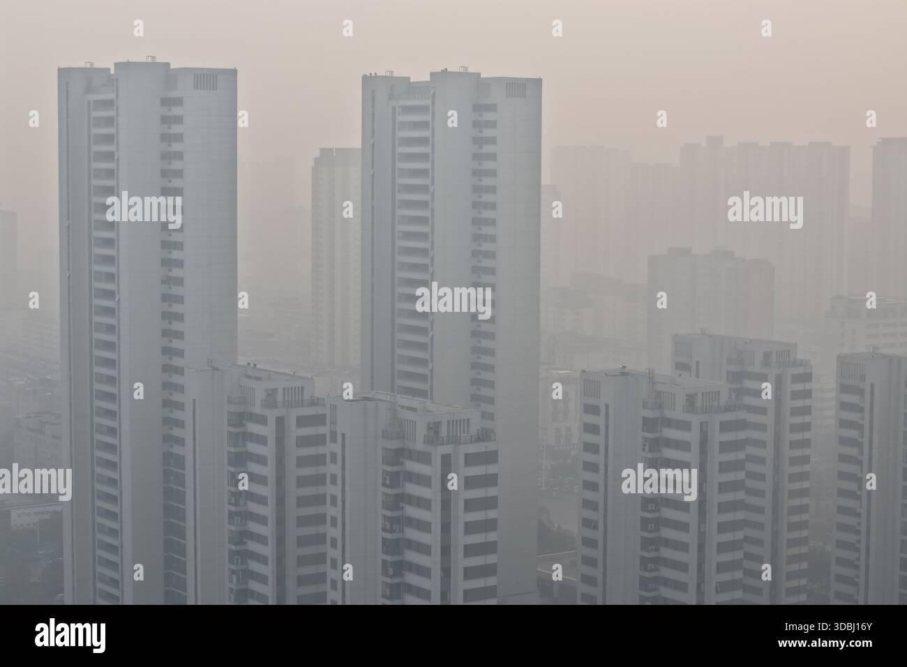 Buildings are faintly visible in the haze in Fuyang City, Anhui ...
