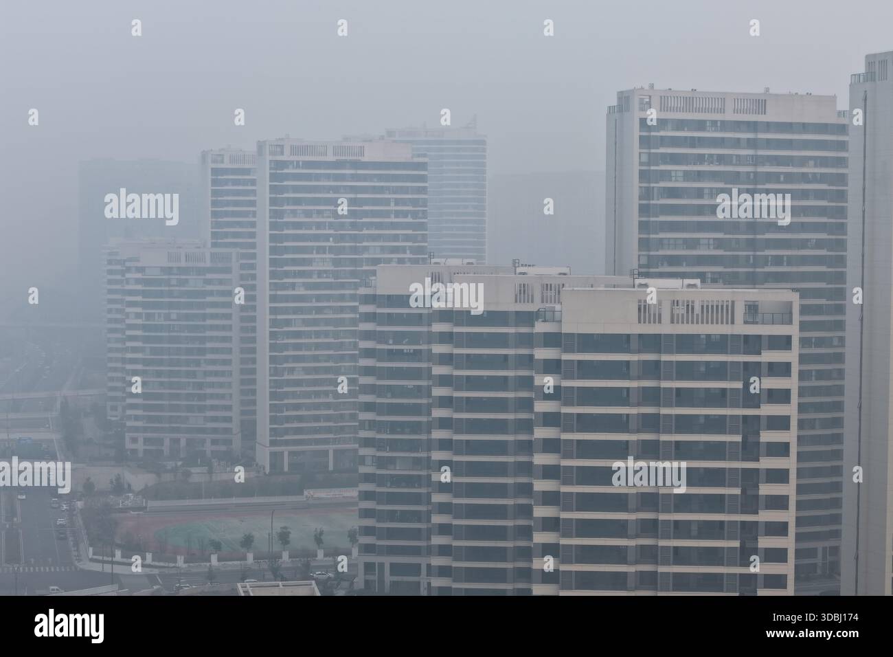 Buildings are faintly visible in the haze in Fuyang City, Anhui ...