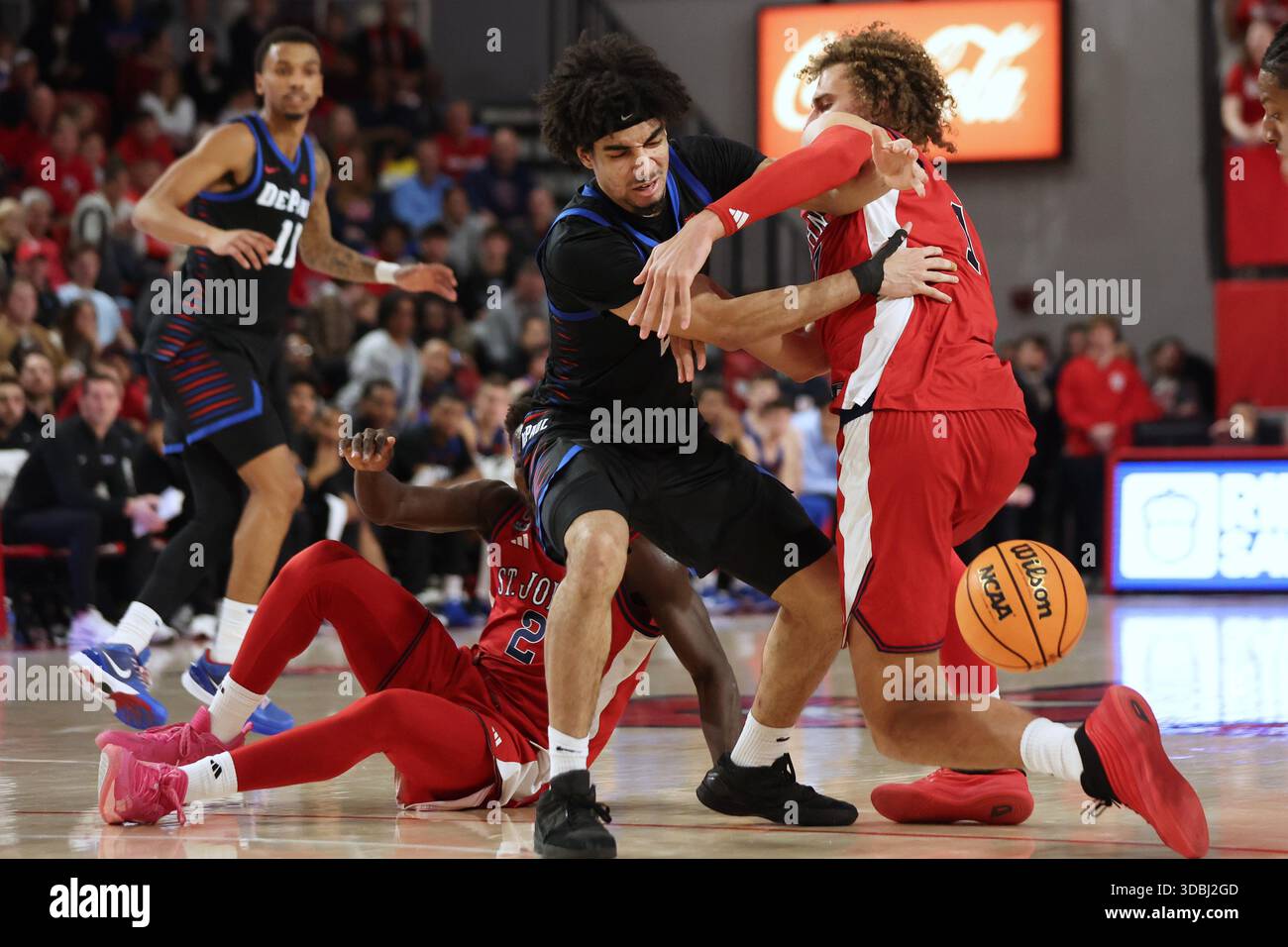 DePaul guard RJ Smith, center, and St. John's forward Rubén Prey, right ...