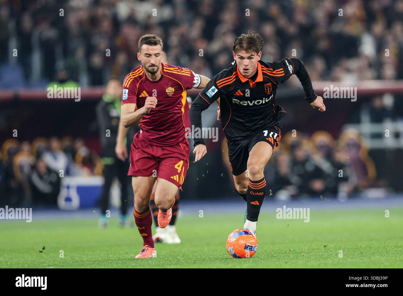 Bryan Cristante of AS Roma (L) and Nico Paz of Como (R) seen in action ...
