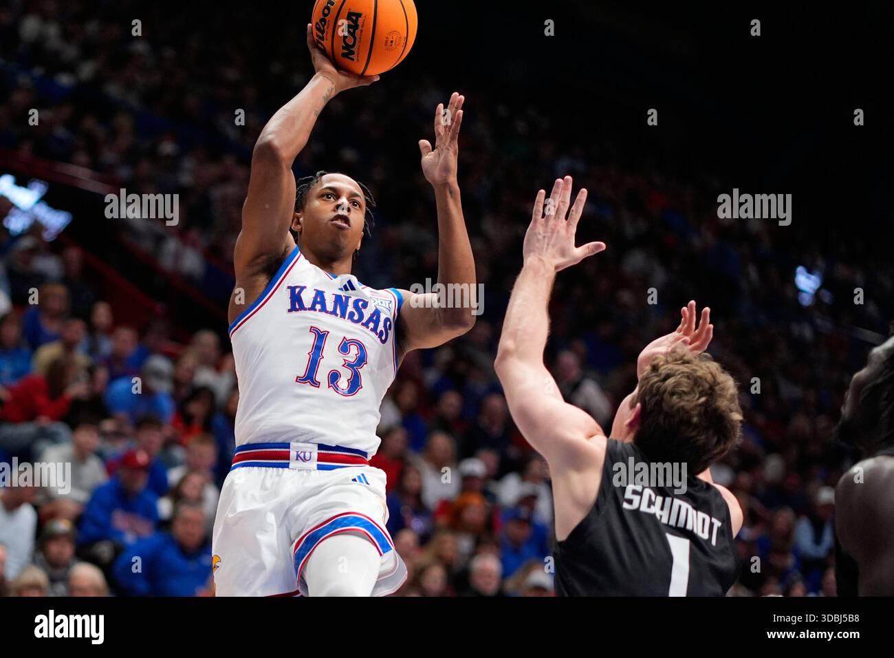 Kansas guard Elmarko Jackson (13) shoots over Towson guard Tyler ...