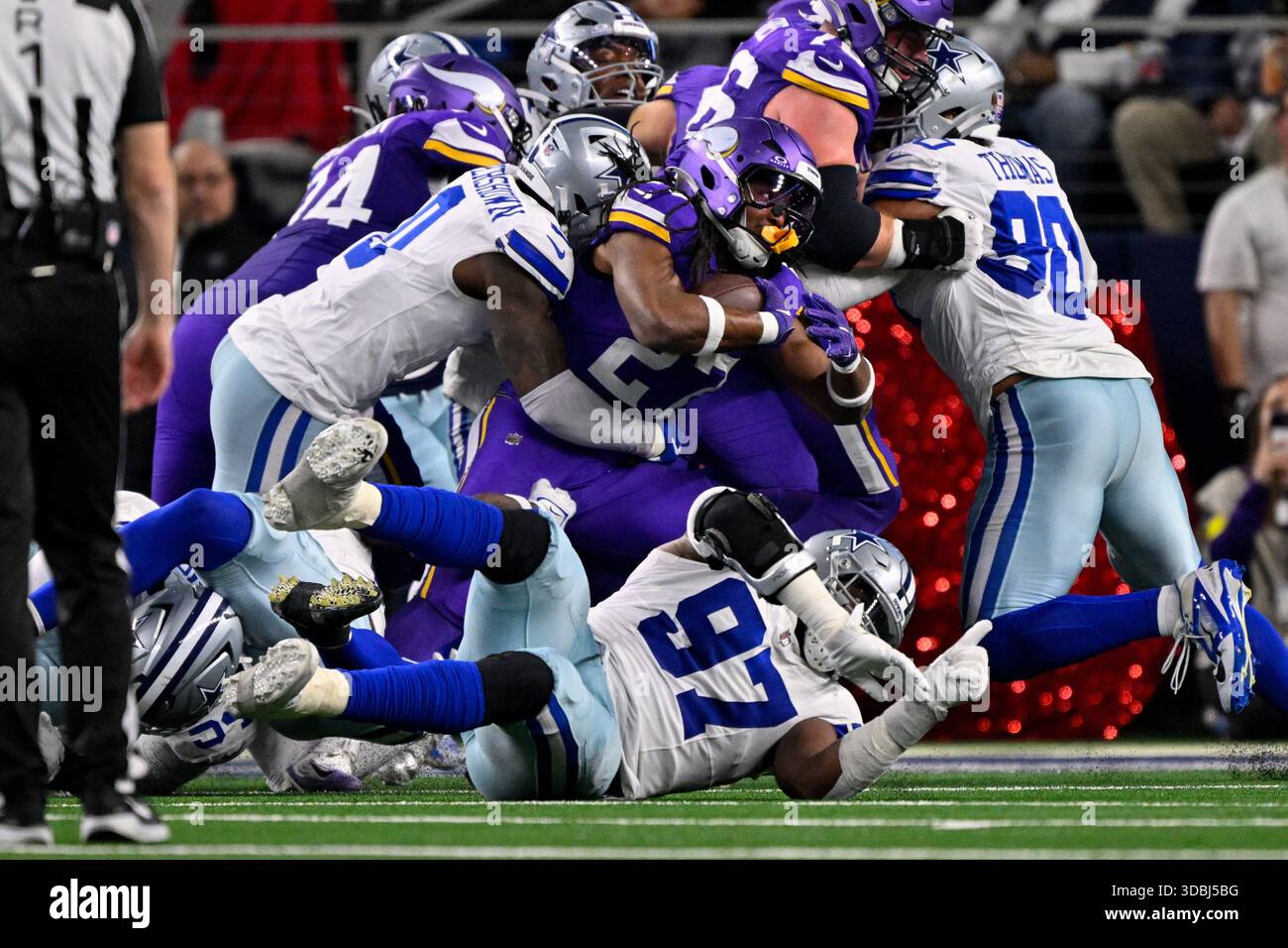 Minnesota Vikings running back Jordan Mason (27) is tackled by Dallas ...