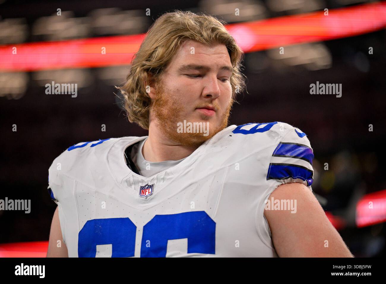 Dallas Cowboys guard T.J. Bass (66) looks on from the team bench during ...