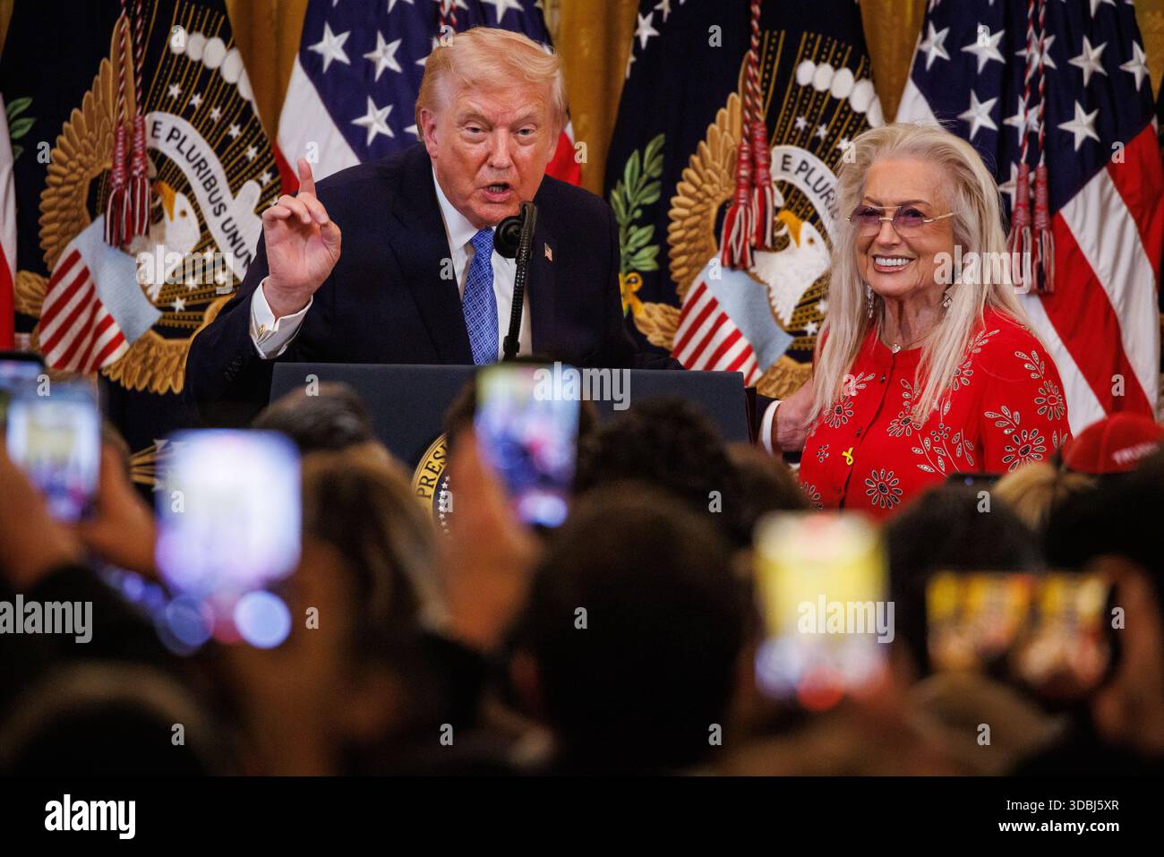 U.S. President Donald Trump author Miriam Edelson on stage during a ...