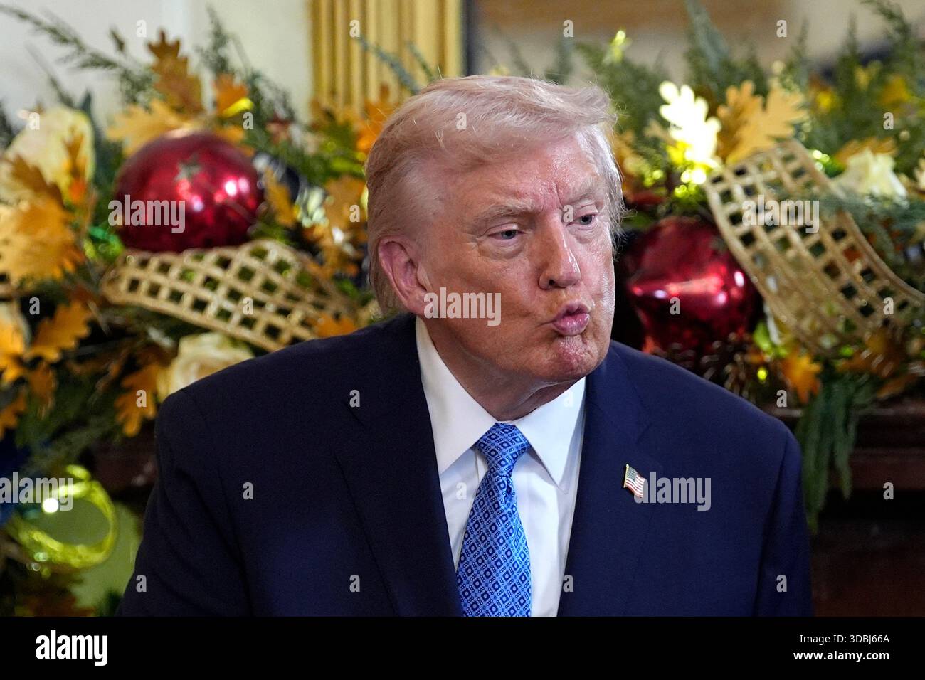 US President Donald Trump blows a kiss during a Hanukkah reception in ...