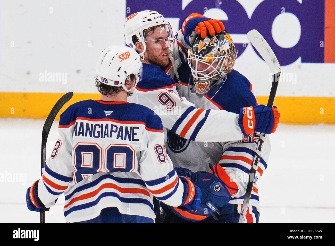 Edmonton Oilers goaltender Tristan Jarry, right, celebrates with Connor ...