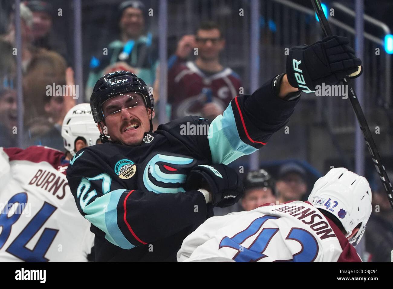 Seattle Kraken left wing Mason Marchment, left, swings at Colorado ...