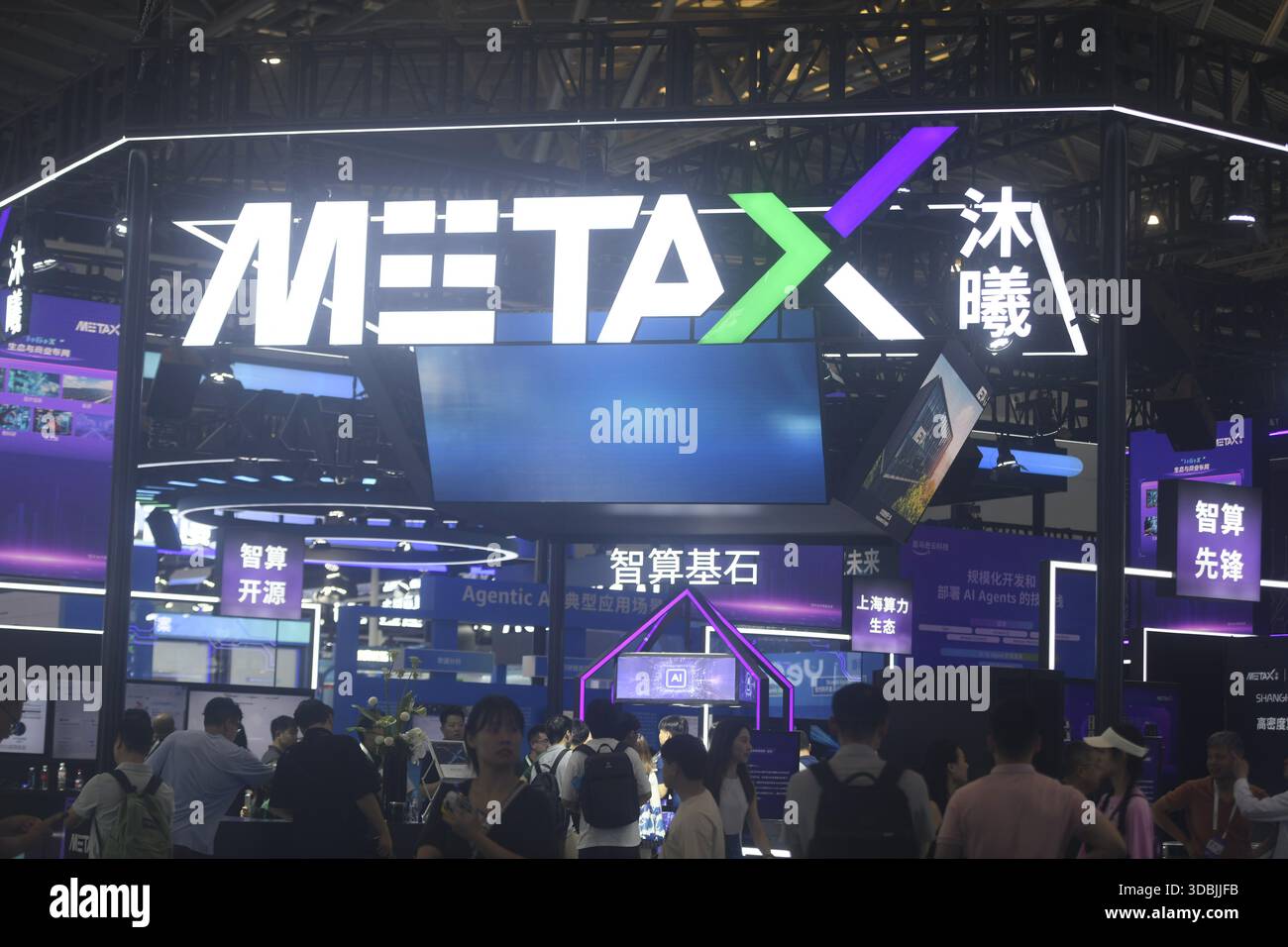 Viewers watch various AI and GPU chips launched by Metax at the World ...