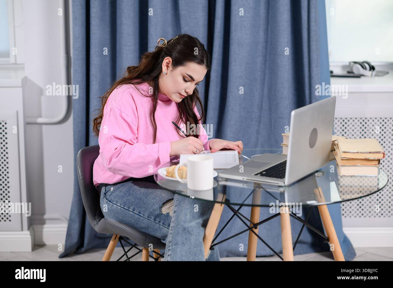 Woman studies intently taking hi-res stock photography and images - Alamy