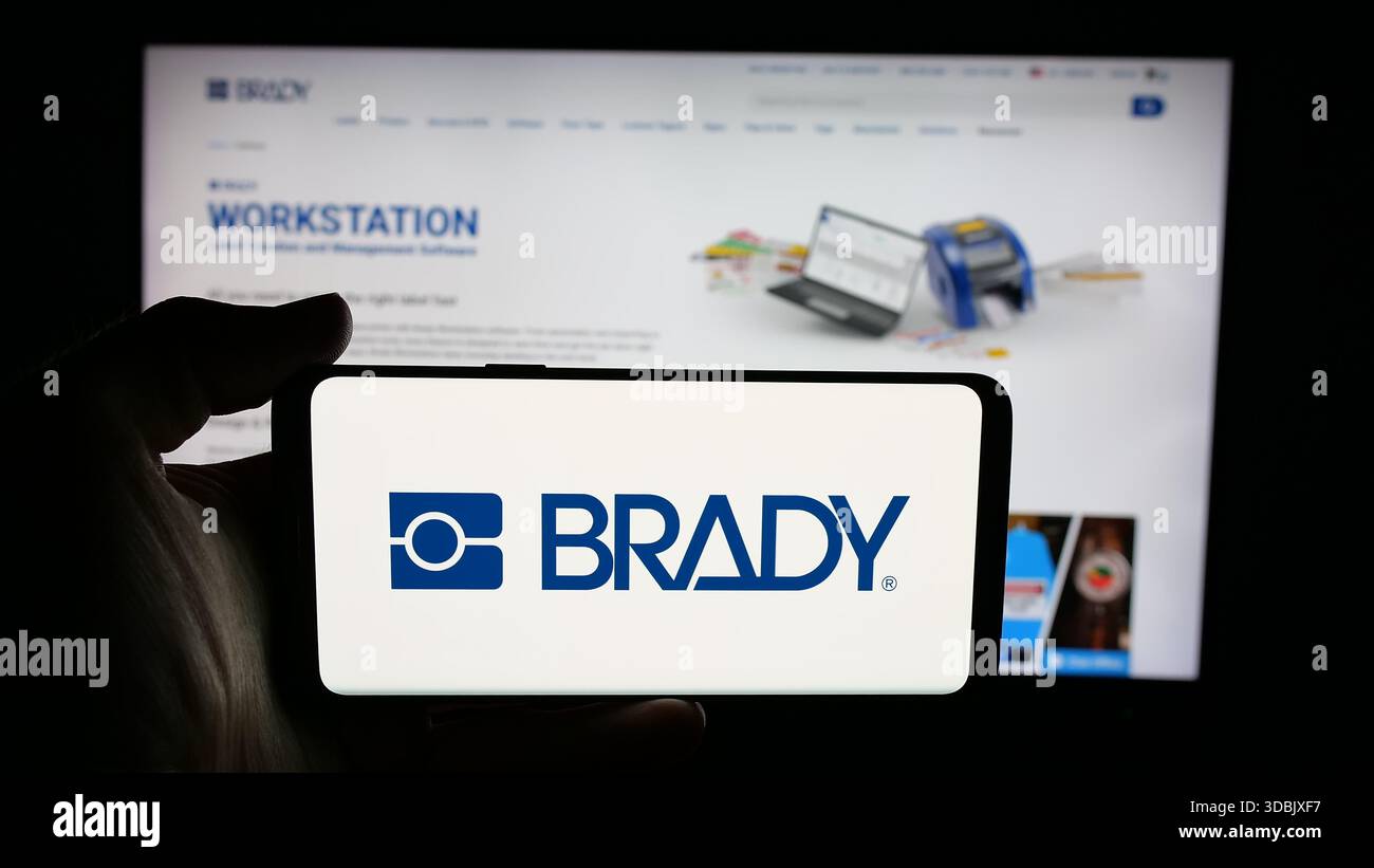 In this photo illustration, a person is holding a cellphone with the ...