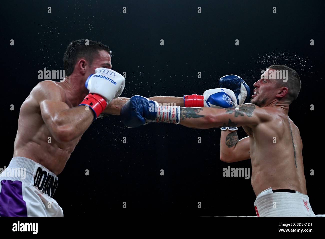 Koen Mazoudier in action against Dominic Molinaro during their Australian Super Welterweight ...