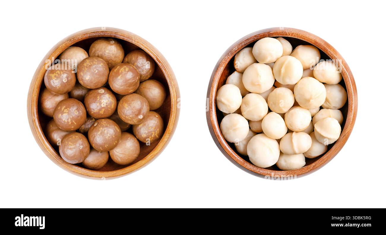 Macadamia nuts, in shells and peeled, in wooden bowls. Also known as ...
