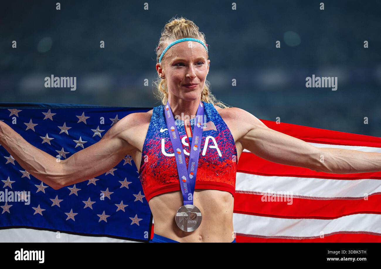 Sandi Morris celebrating her medal with her country's flag at the 2025 ...