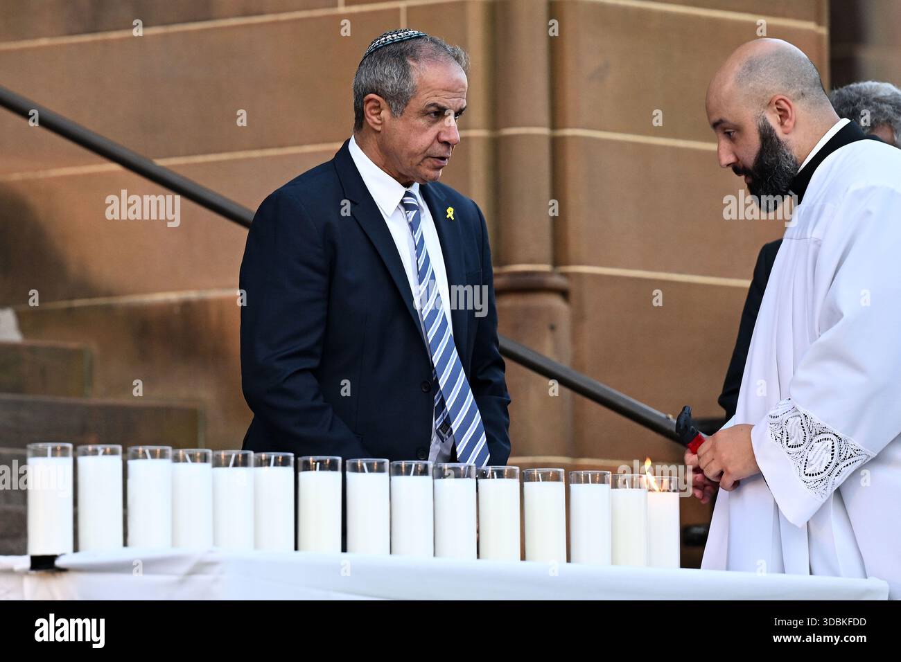 Israel's ambassador to Australia, Amir Maimon lights a candle for the ...
