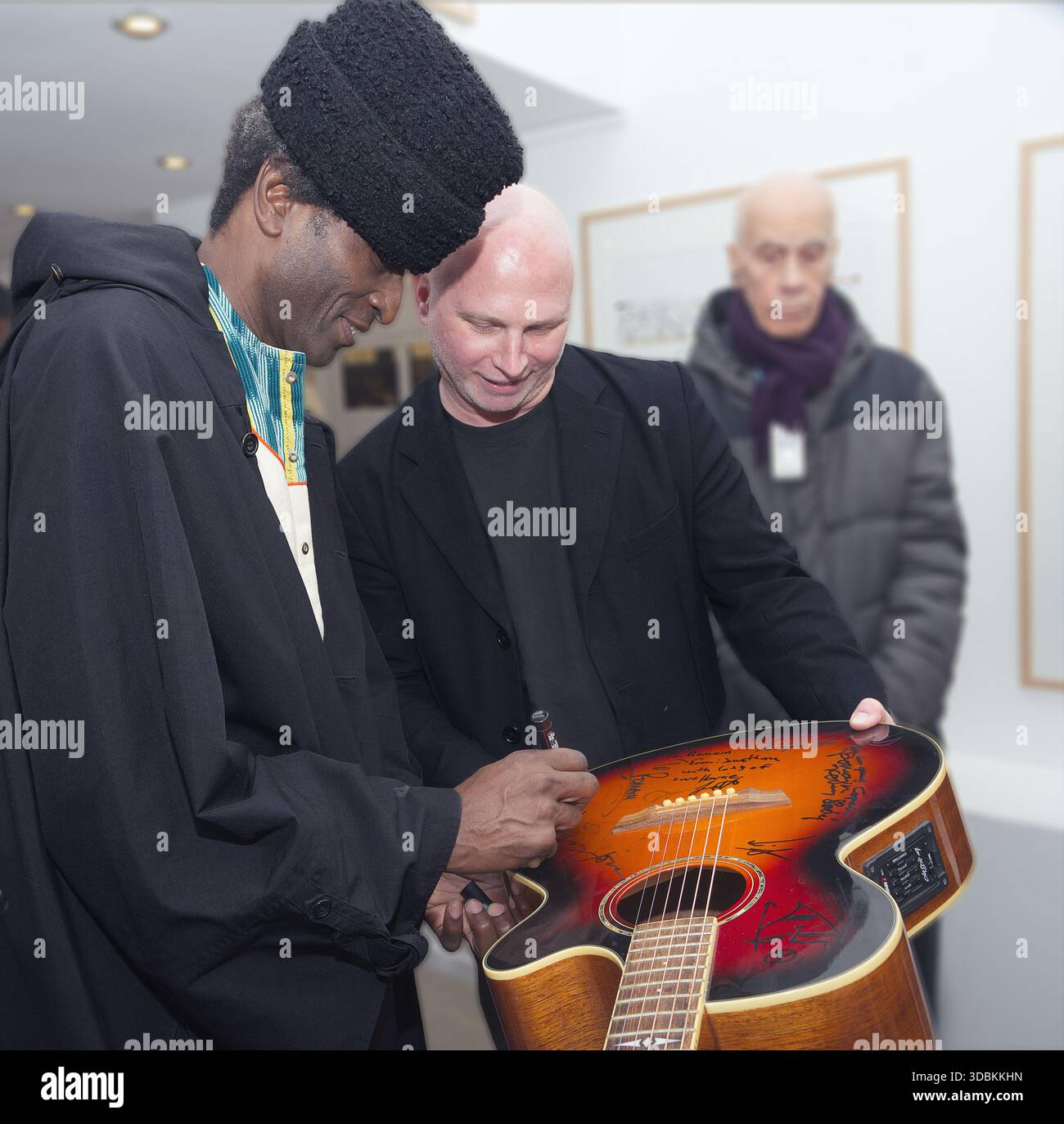 Paris, France. December 16, 2025. Keziah Jones and gallery owner Romain ...