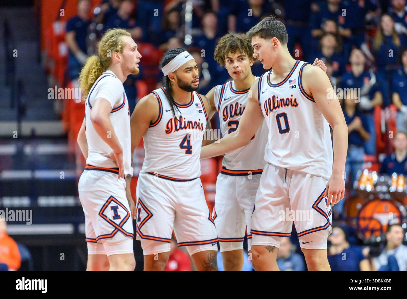 Illinois players Jake Davis (15), Kylan Boswell (4), Keaton Wagler (23 ...