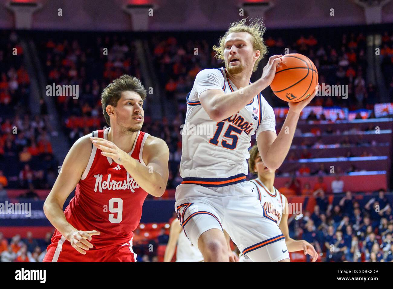 Illinois' Jake Davis grabs a rebound from Nebraska's Berke Büyüktuncel ...