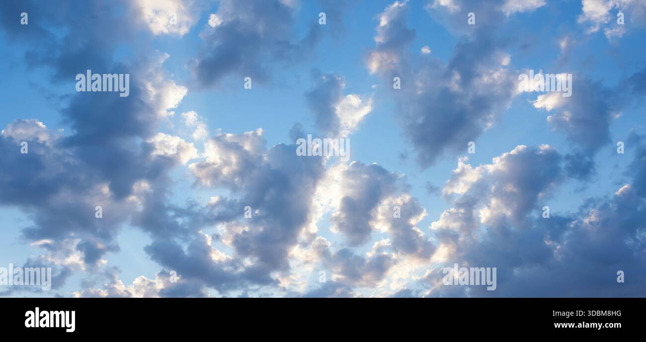 Sunny clear blue sky with white and gray clouds. Seasonal cloudscape ...