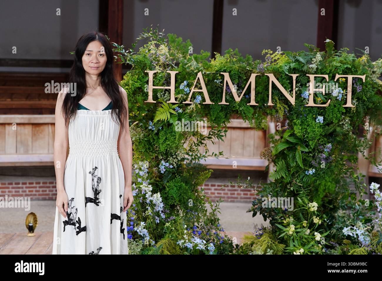Chloe Zhao attending a photocall for Hamnet, at Shakespeare's Globe in ...