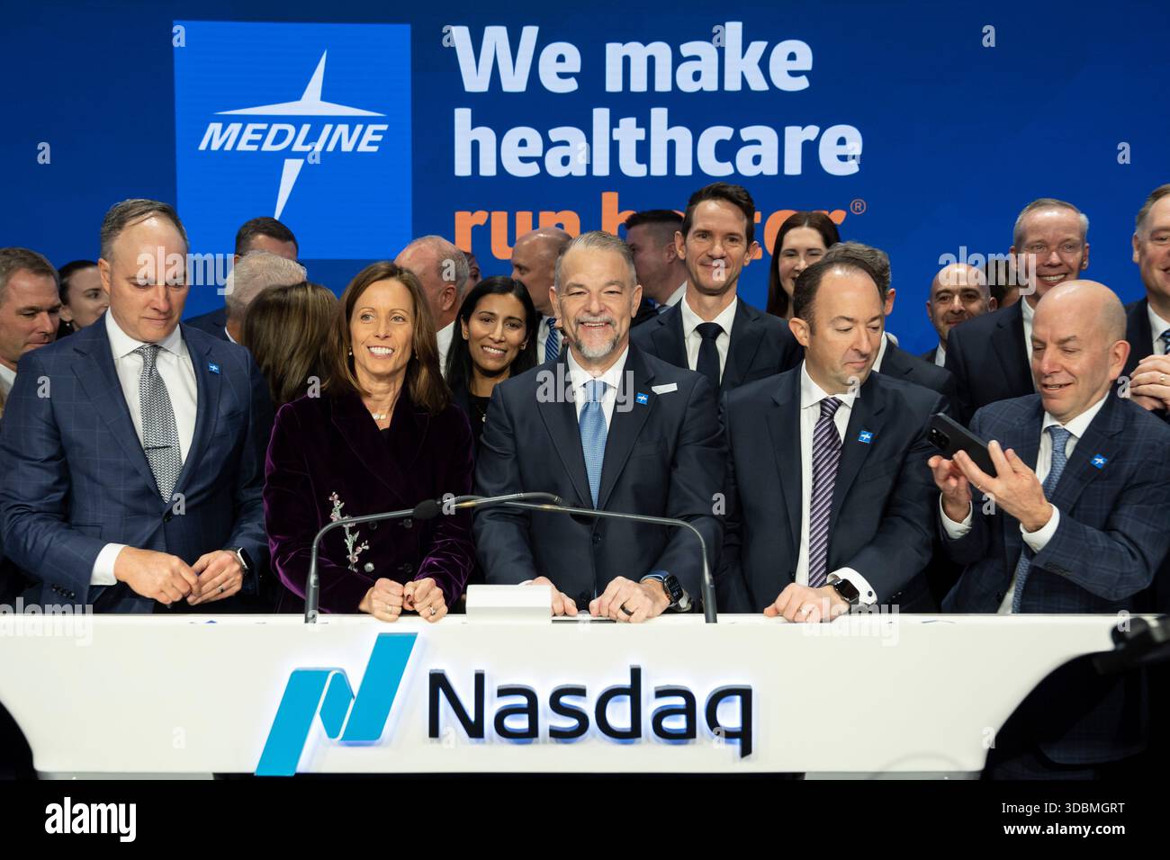 Jim Boyle, CEO of Medline Industries, center, poses for a picture ...