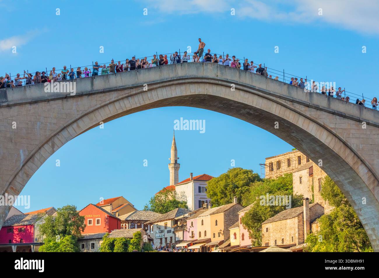 Crowd of tourists on Stari Most bridge in Mostar, waiting to see the ...