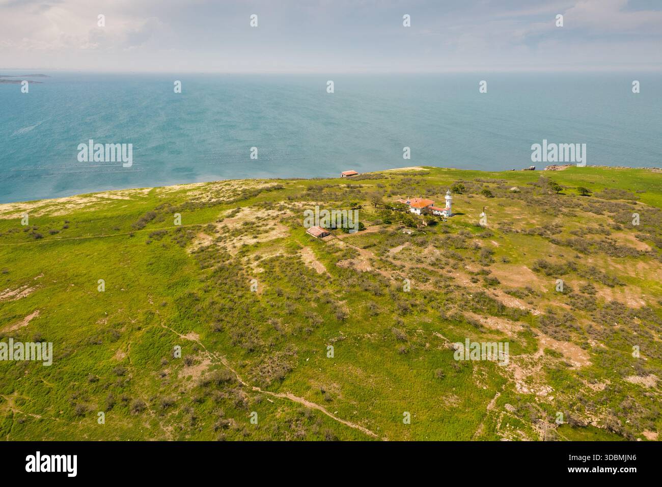 Aerial view of St. Ivan Island's verdant landscape meets the azure sea ...